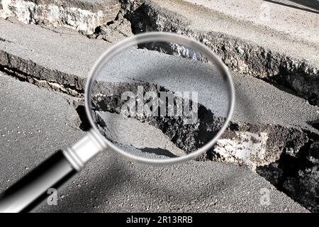 Cracked asphalt road damaged after a structural failure - Concept image ...