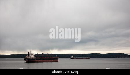An ocean going cargo ship sits at its mooring outside of Nanaimo BC to ...