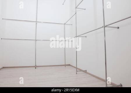 Metal pipes near white walls in empty office room. Interior design ...