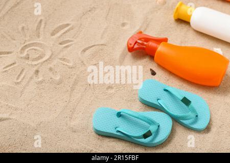 Creative composition with different sunscreen creams and palm leaves on ...