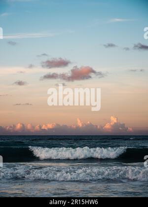 The setting sun lighting up the cloud with a pinkish colour Stock Photo ...