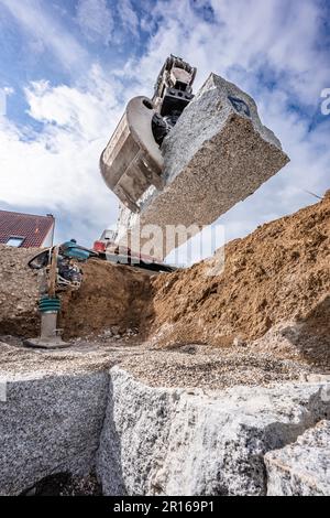 Excavator grab with stone on construction site, Calw, Germany Stock ...
