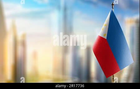 Small flags of the Philippines on an abstract blurry background Stock ...