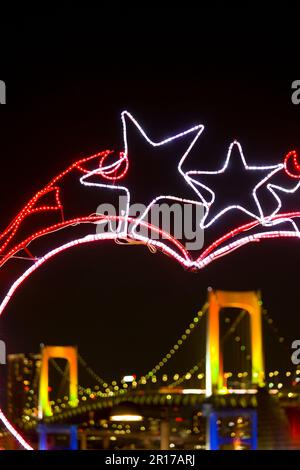Lit up Rainbow Bridge and illuminations Stock Photo - Alamy
