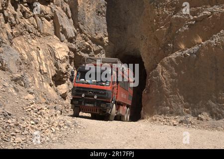 People's Republic of China, Tibet: Rotel bus waiting to enter tunnel ...