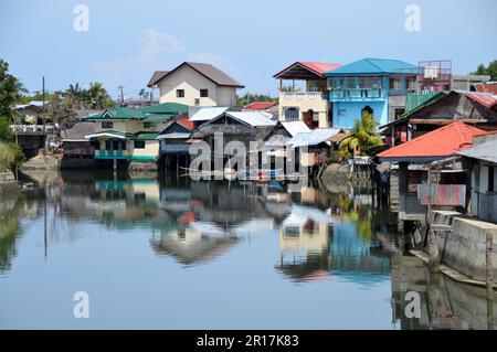 The Philippines, Samar Island, Calbayog: colourful waterside dwellings ...