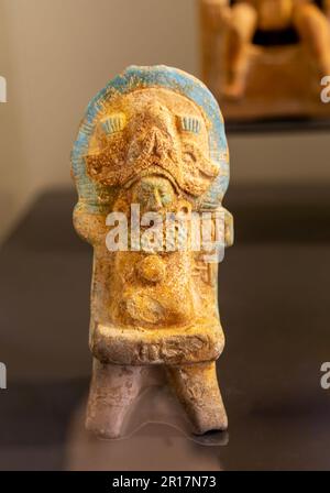 Mayan figurine sitting on a throne and embossed glyphs. Late Classic ...