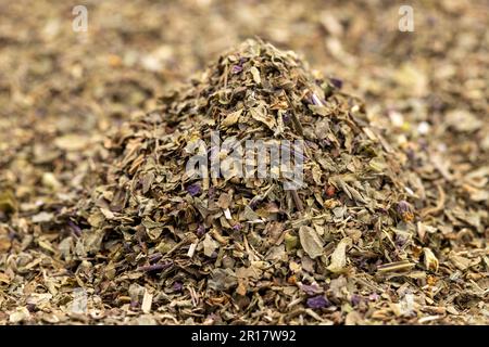 Close-up Dried crushed basil background. Dried ground basil powder ...