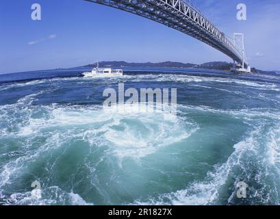 Naruto whirlpools, tourist ship and ?naruto Bridge Stock Photo - Alamy