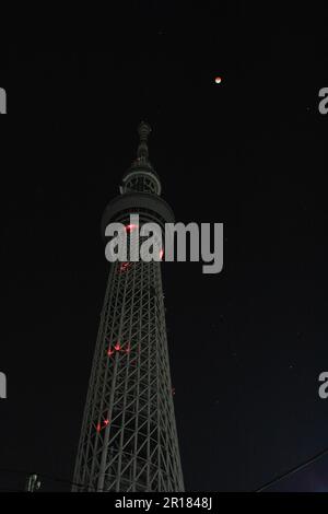 Total lunar eclipse and Tokyo sky tree Stock Photo - Alamy