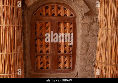 details of window with reed lattice and columns on a building in ...
