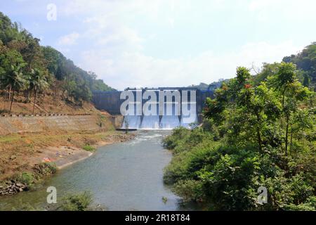 Water rushing through gates at the peruvannamuzhi (peruvannamoozhi) dam ...