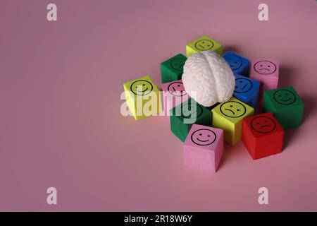 Human brain with happy, neutral and sad icon. Mental health, mood ...