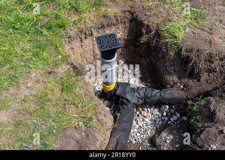 Overflow and infiltration well connected to drainage pipes, dug in a ...