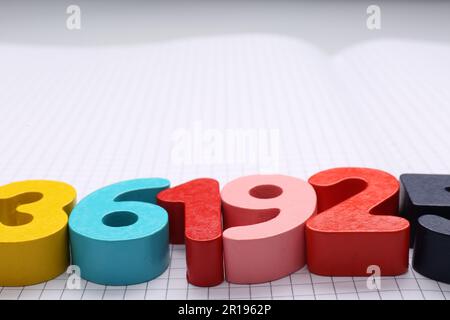 Colorful numbers on notebook with grid pages. Space for text Stock ...