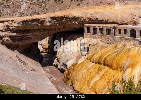 The Inca Bridge ruins. Abandoned spa building at Puente del Inca ...