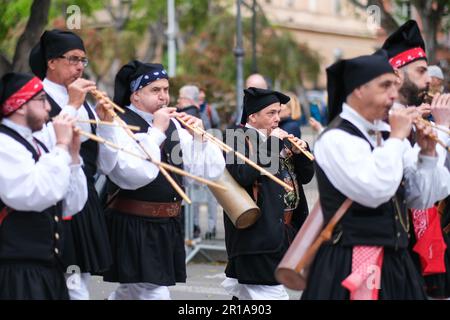 Sardinian men playing traditional wood flutes known as launeddas join ...