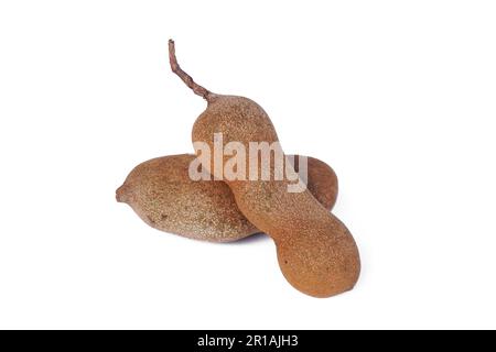 Tamarind fruit with broken shell isolated on white background Stock ...
