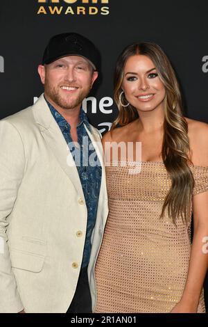 Cole Swindell, Courtney Little attend the 58th Academy Of Country Music ...