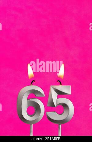 Birthday candle number 65 on white background Stock Photo - Alamy