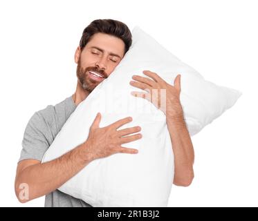 Sleepy handsome man hugging soft pillow on white background Stock Photo ...