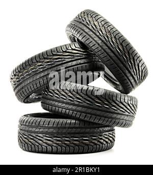 Four new black tires isolated on white background Stock Photo - Alamy