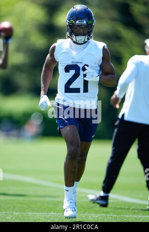 Seattle Seahawks cornerback Devon Witherspoon (21) walks onto the field ...