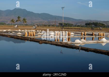 The process of crystallization of sea water into salt in the ...