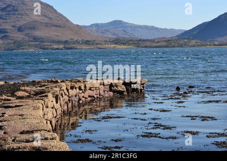 The quay at Inveralligin on Loch Torridon, looking across to Ben Damph ...