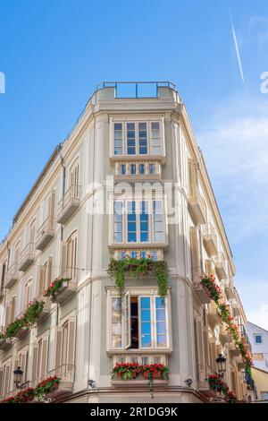 Building with flower window boxes - Malaga, Andalusia, Spain Stock ...