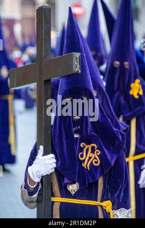 Members of the Cofradía Penitencial de Ntro. Padre Jesús Nazareno carry a Crucified Jesus in ...
