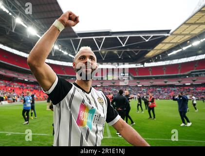 Notts County's John Bostock celebrates with the trophy after the ...