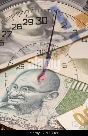 Stopwatch with chinese yuan. Time is money concept Stock Photo - Alamy