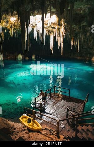 a swimmable cenote – a natural underground pool caused by a sinkhole in ...