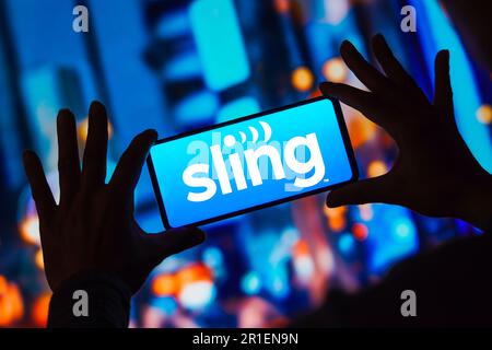 In this photo illustration, the Sling TV logo is displayed on a ...