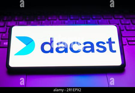In this photo illustration, the Dacast logo is displayed on a ...