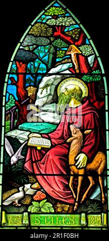 A stained glass window by Alex Booker depicting Saint Giles with his ...