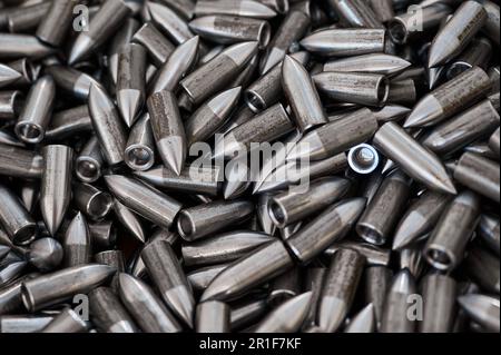 Scattered grey bullets armour ammunition as background Stock Photo - Alamy