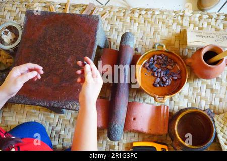 Ancient mayan chocolate making with metate grinding stone in Guatemala ...
