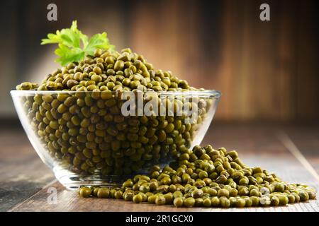 Composition with bowl of vigna mungo bean on wooden table Stock Photo ...