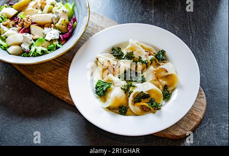 A plate of traditional East European dumplings, Pierogi Stock Photo - Alamy