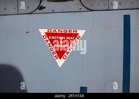 Caution warning sign on fuselage and wings of modern jet fighter ...