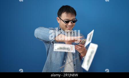Young man wearing funny thug life glasses over isolated background ...