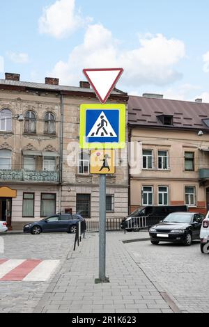 Different road signs on city street. Traffic rules Stock Photo - Alamy
