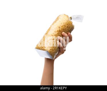 hand holding plastic bag with macaroni pasta Stock Photo - Alamy