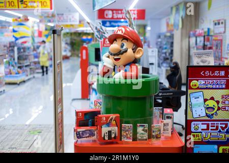 Nintendo's Super Mario figurine at a toy store entrance in Yokohama ...