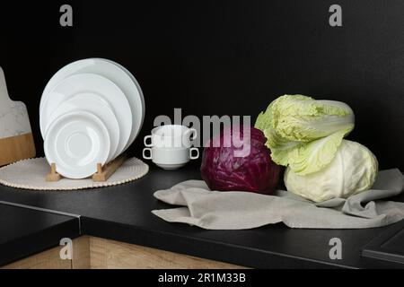 Different types of cabbage on countertop in kitchen Stock Photo - Alamy