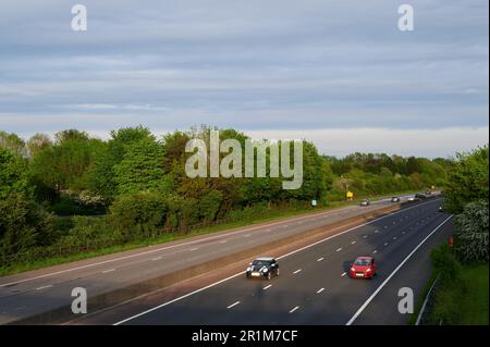 overhead image of three lane motorway in daylight with motion blur of ...