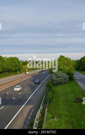 overhead image of three lane motorway in daylight with motion blur of ...