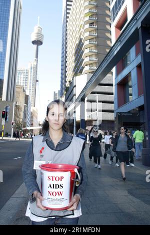 A collector seeks public donations for the Aids Trust of Australia on ...